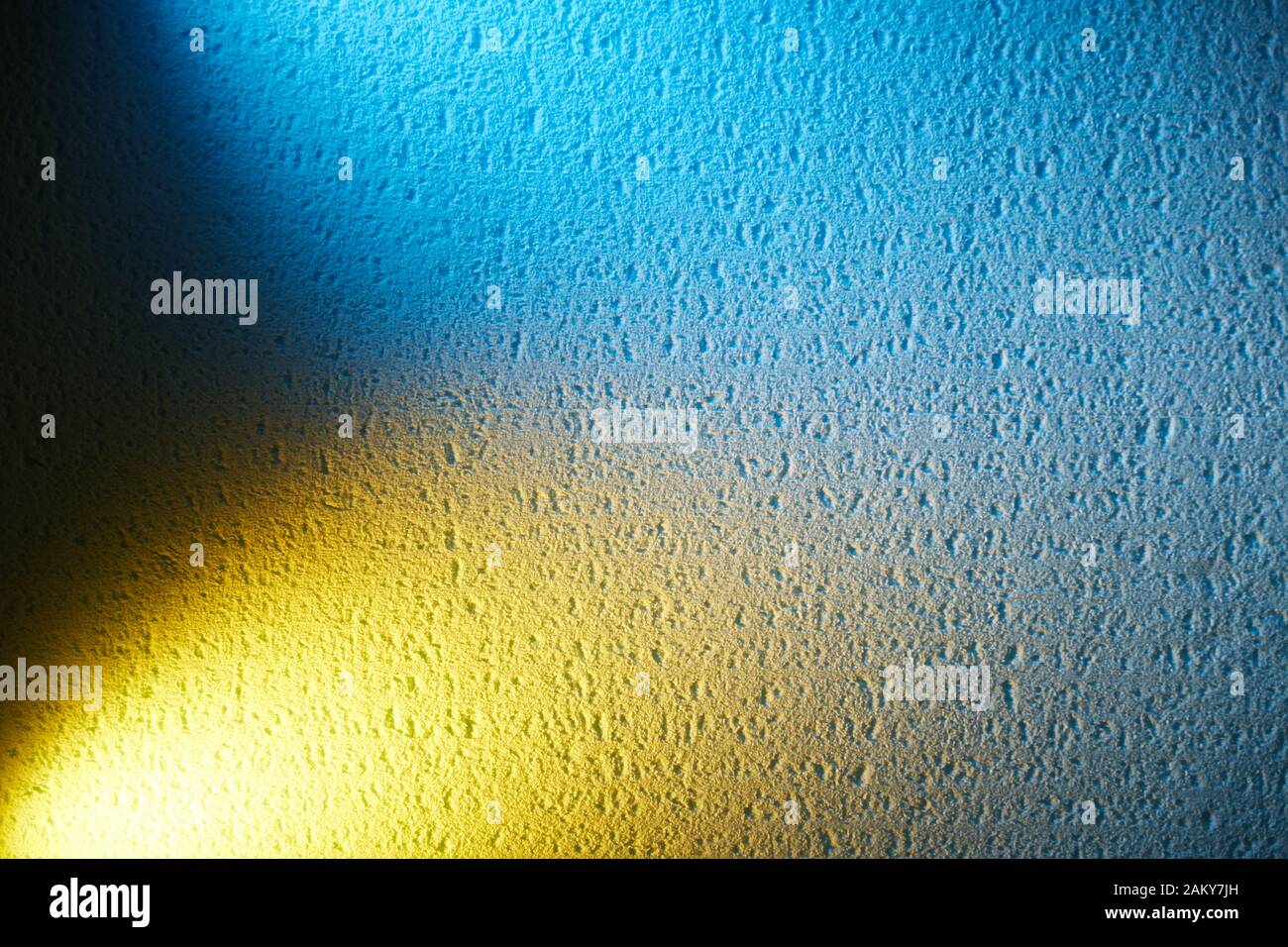 Two bright beams of blue and yellow Stock Photo - Alamy