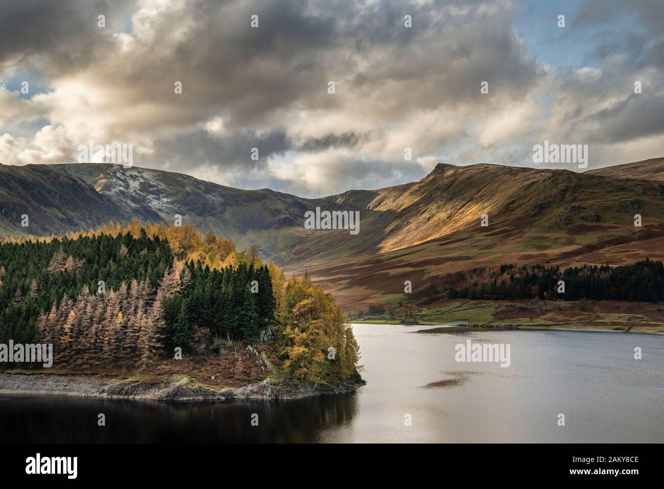 Epic Autumn Fall landscape of Hawes Water with epic lighting and ...