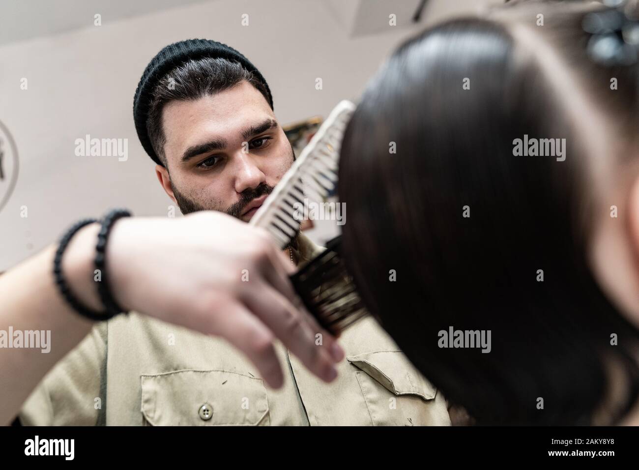 Creating a new hairstyle. Creative haircut from a hairdresser. Men's ...