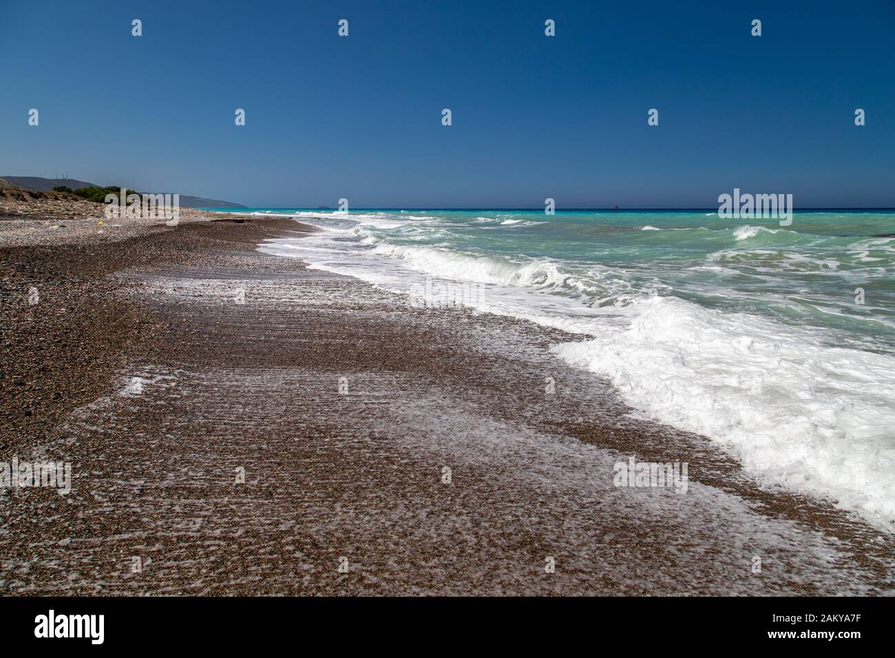 Gravel / pebble beach at the southwest coast of Rhodes island near ...