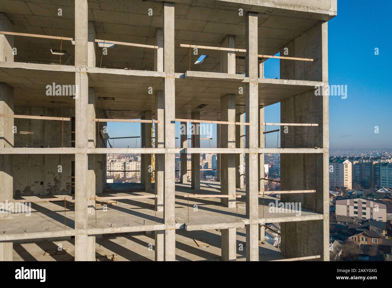 Aerial view of concrete frame of tall apartment building under ...