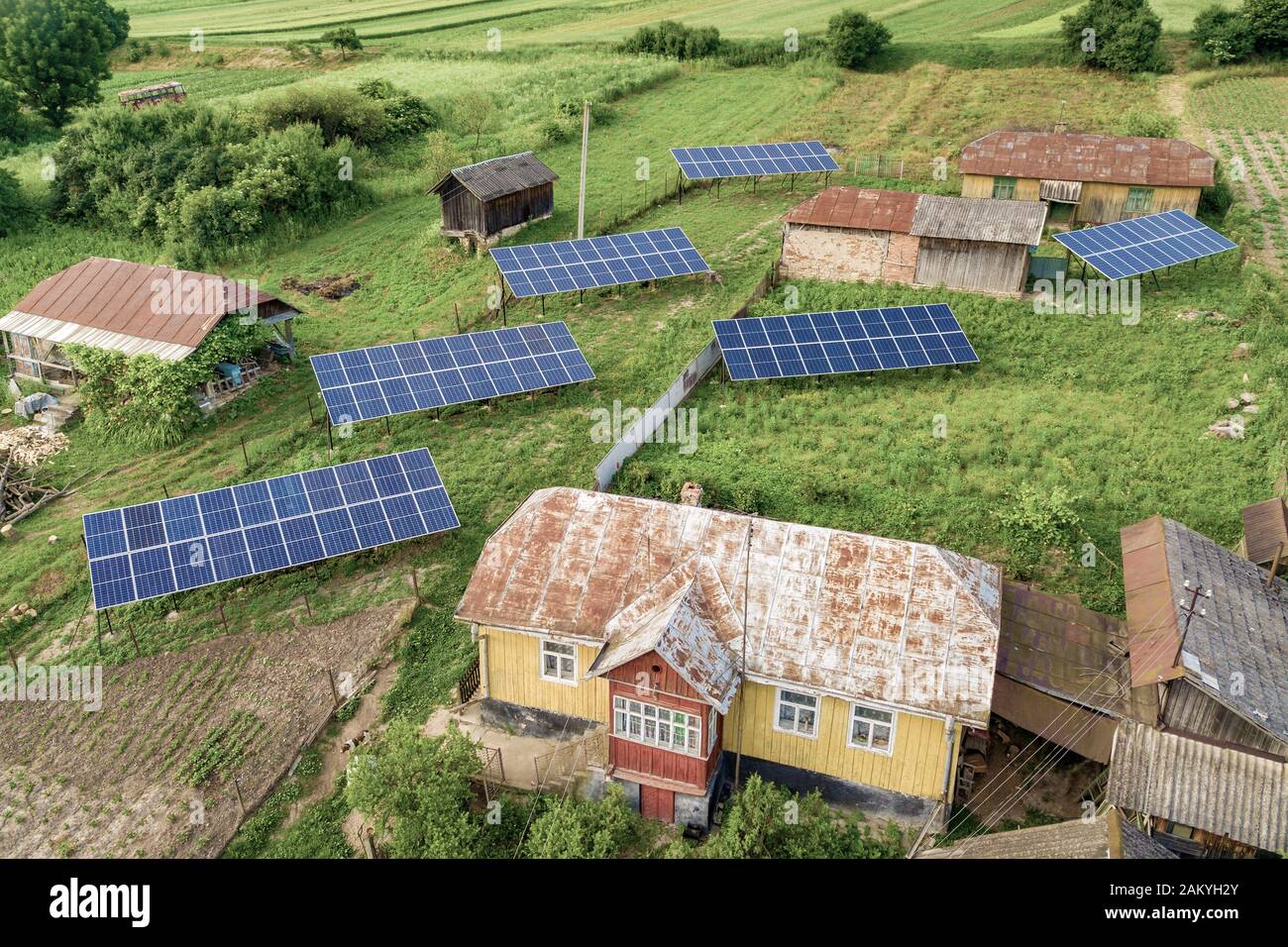 Aerial top down view of solar panels in green rural area Stock Photo ...