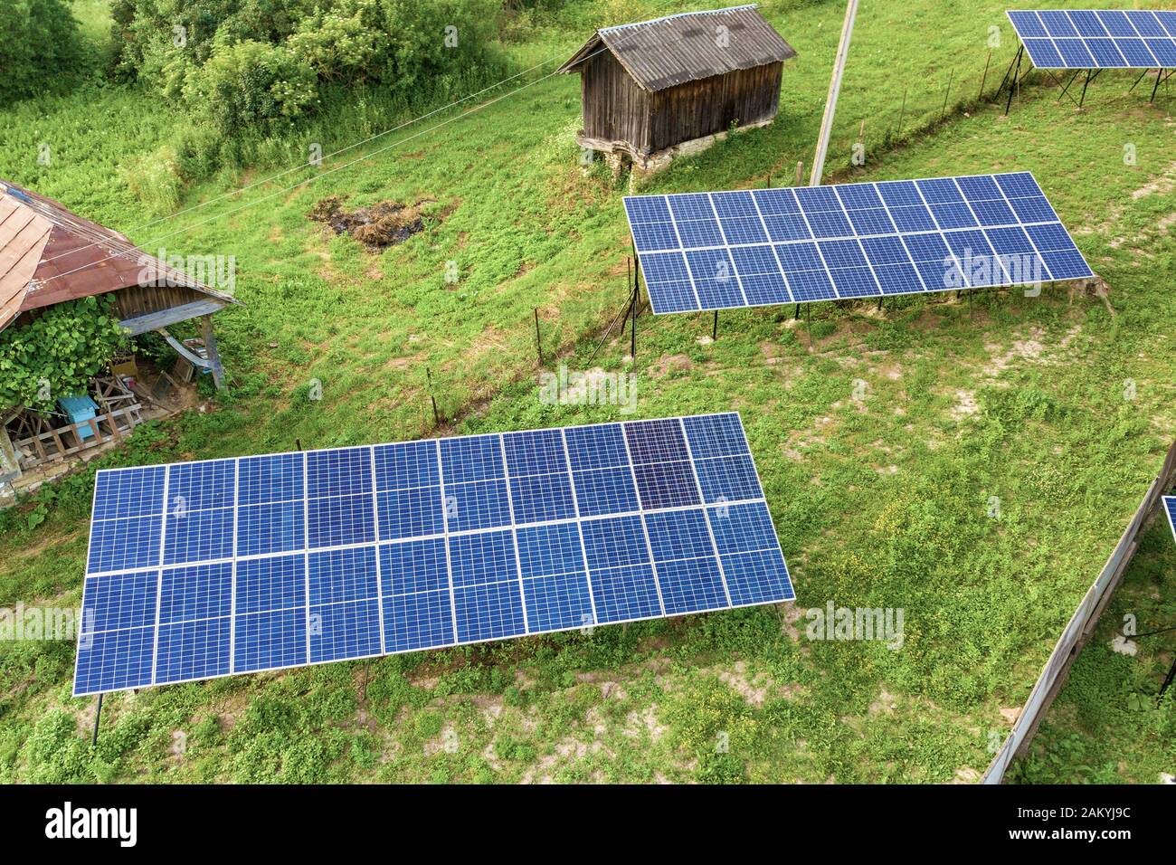 Aerial top down view of solar panels in green rural area Stock Photo ...