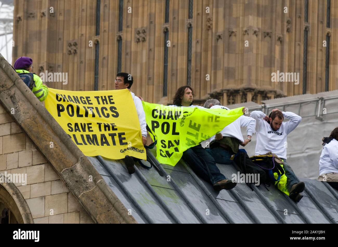 Climate change protest on roof houses parliament hi-res stock ...