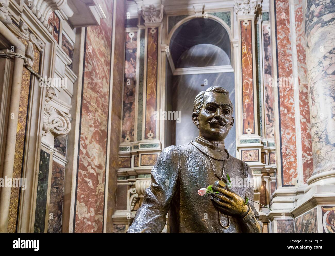 NAPLES, ITALY - JANUARY 3, 2020: light is enlightening the statue of ...