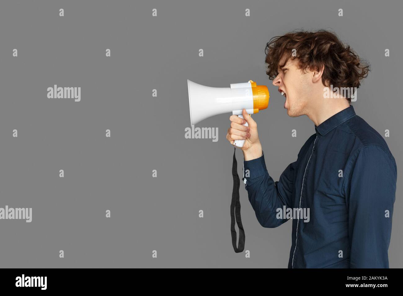 Copy Space for Text or Product. Teenager boy standing isolated on grey ...