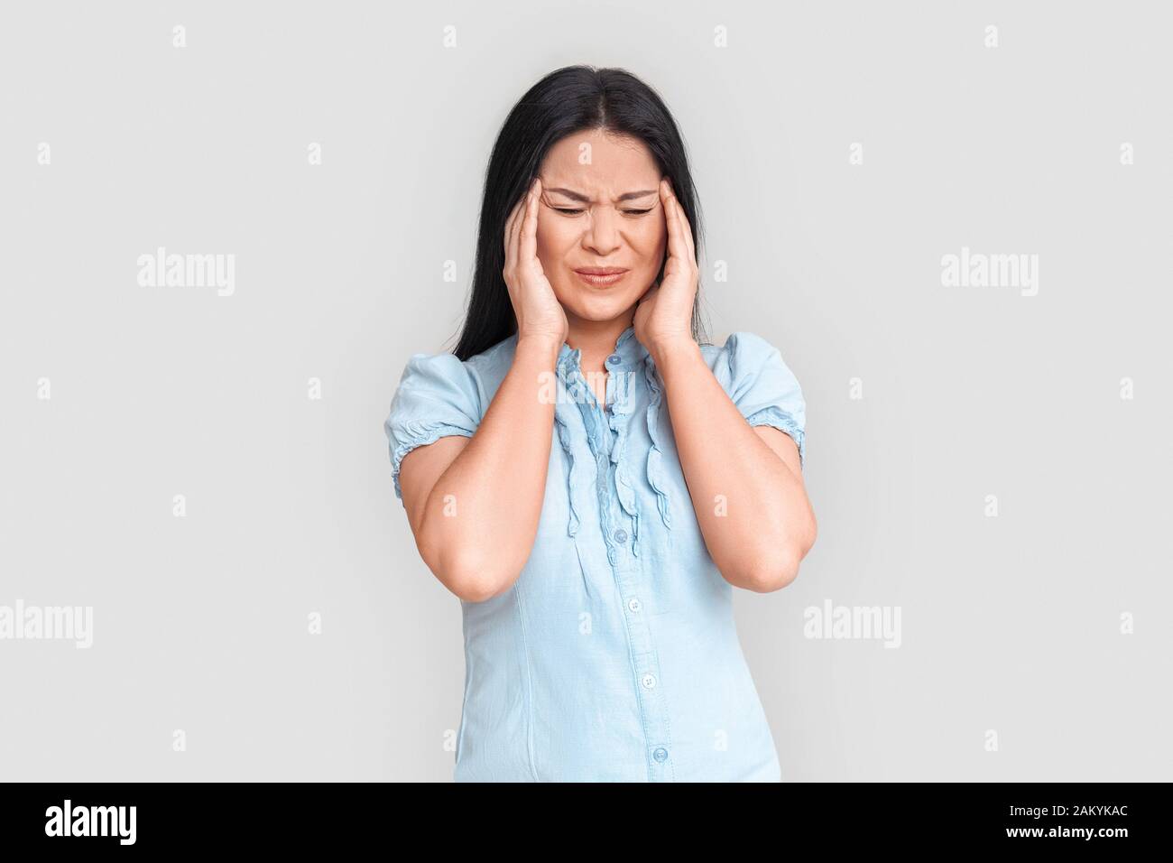 Beautiful asian businesswoman having headache hi-res stock photography ...