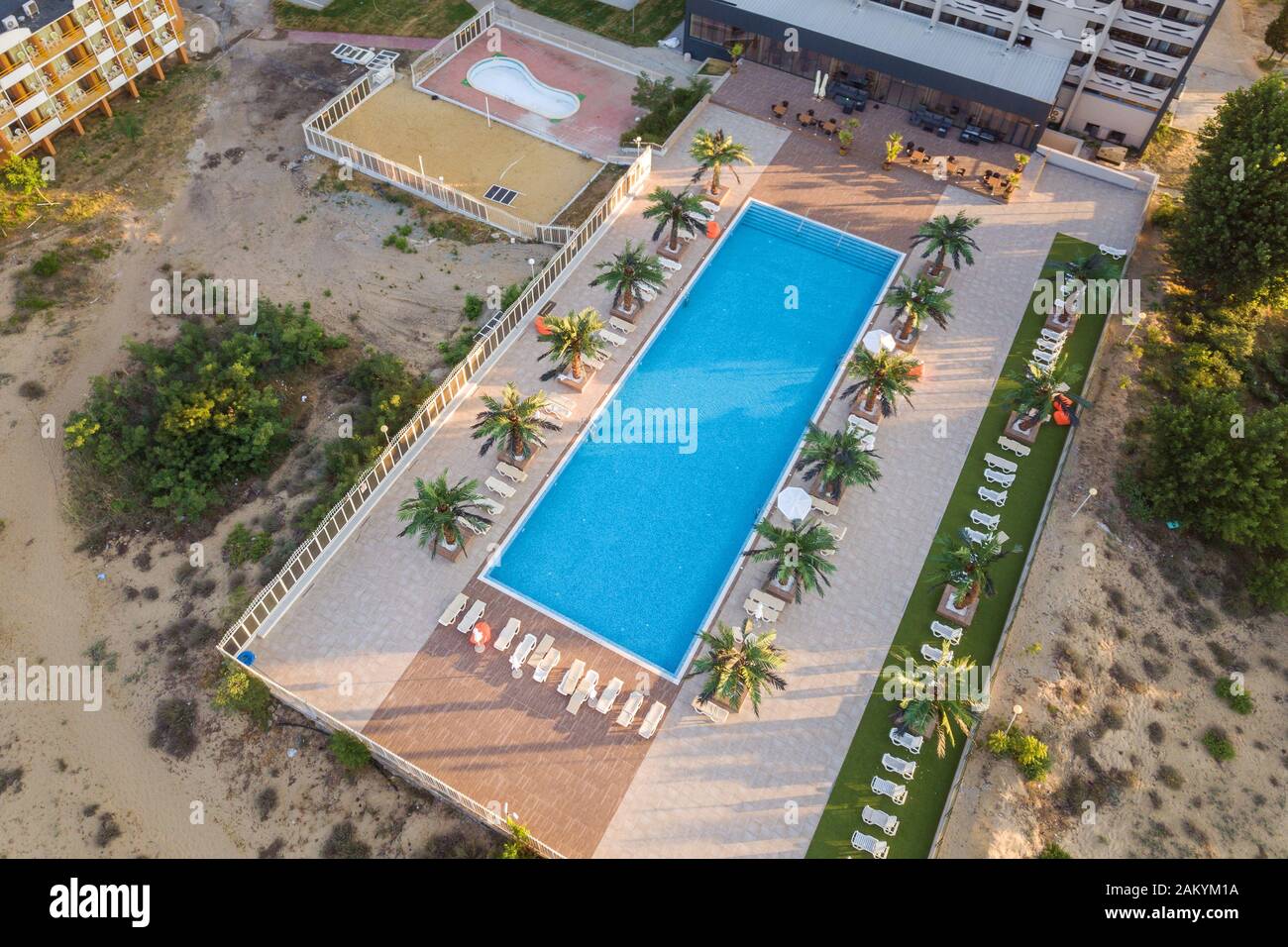 Top down aerial view of hotel swimming pool with crystal blue water ...