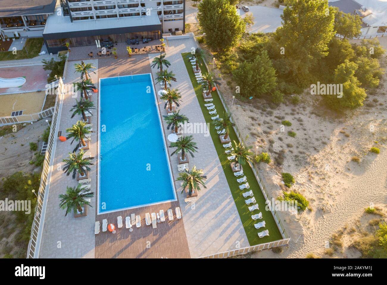 Top down aerial view of hotel swimming pool with crystal blue water ...