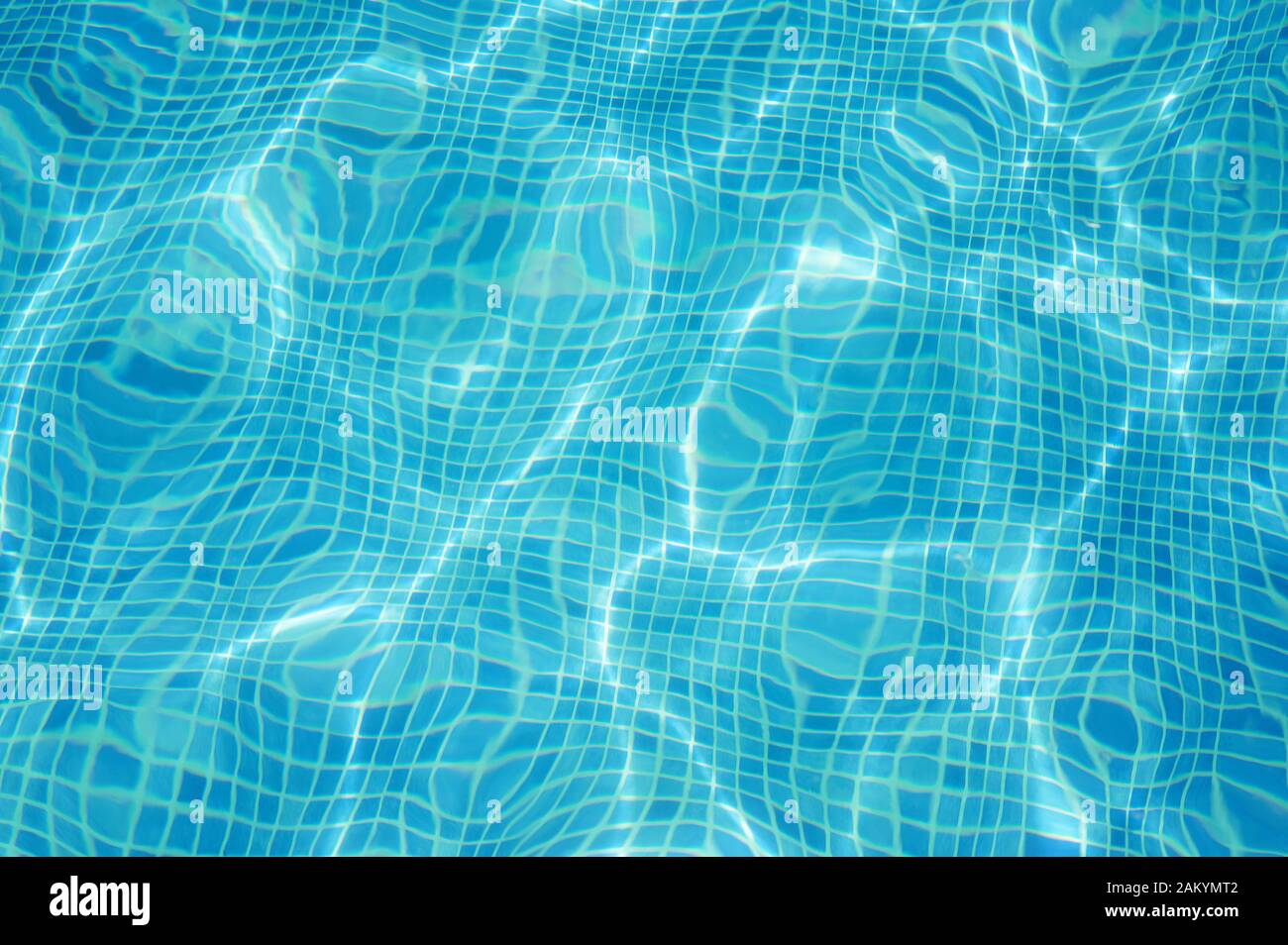 Bright blue bottom of swimming pool background Stock Photo - Alamy