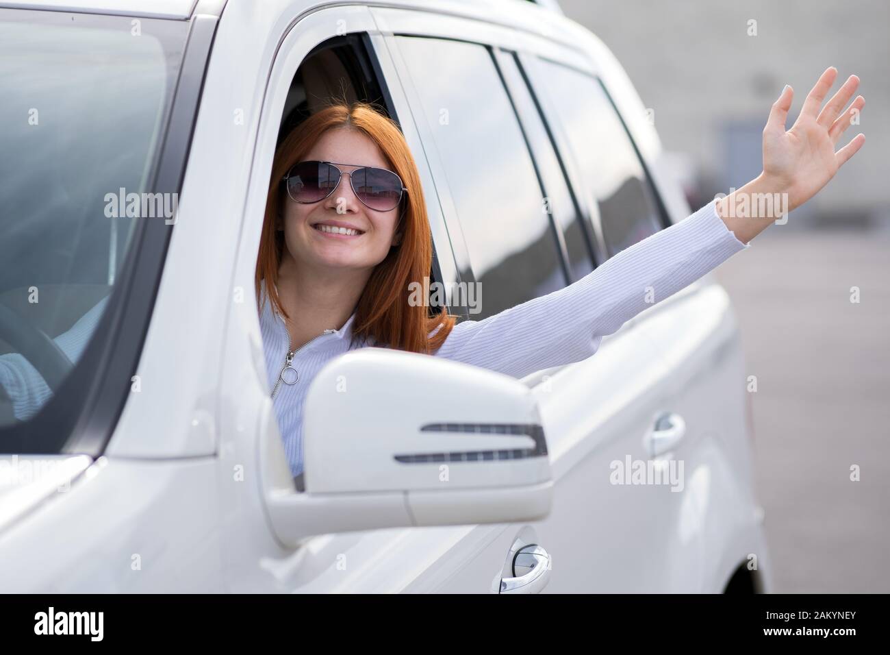 Woman waving hand behind hi-res stock photography and images - Alamy