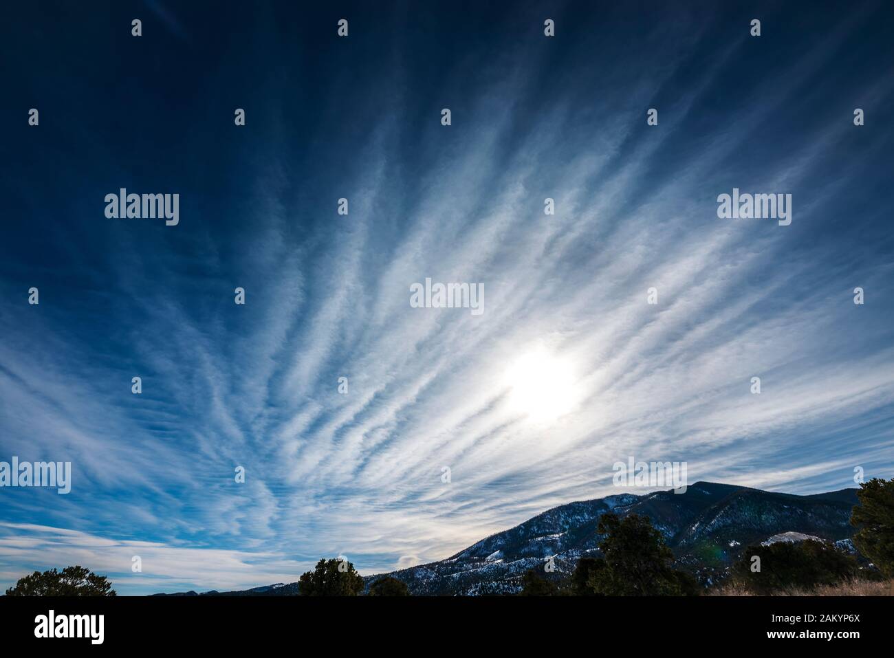 Unusual cloud formations against clear cobalt blue sky; central ...