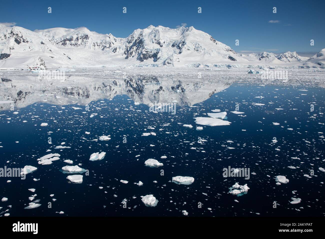 glacier ice, brash ice, sea ice with the mountains and glaciers of ...