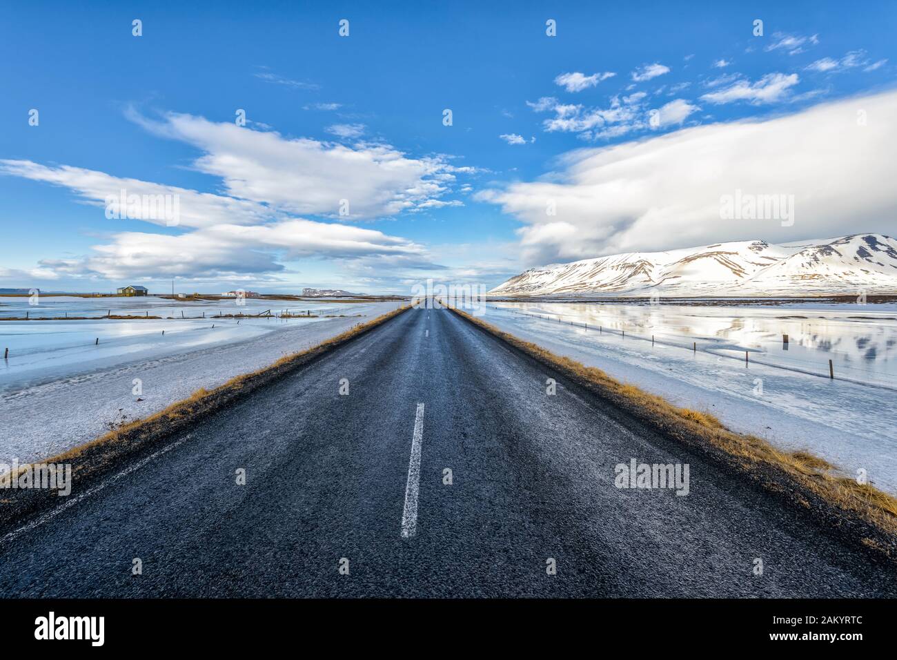 Road along a frozen lake (right), south of village Hofsos, peninsula ...
