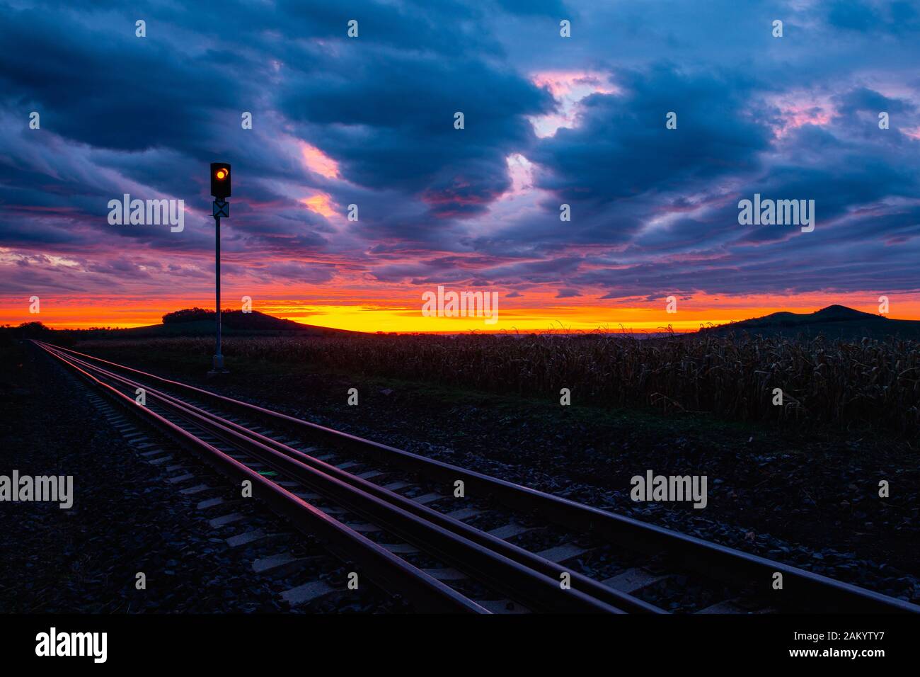 Morning train to the hell. Old Railway tracks running through a field ...