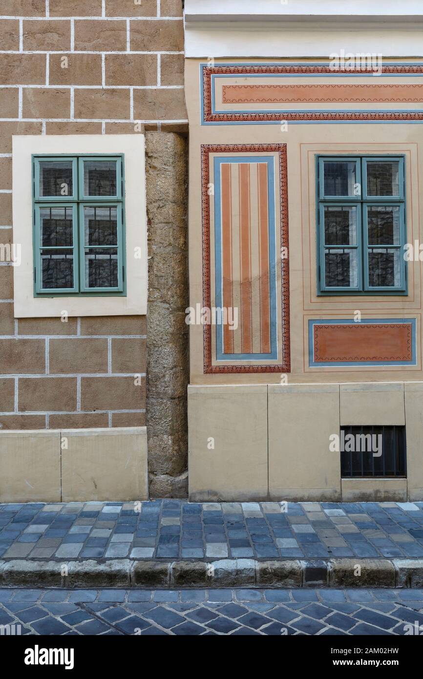 Wall and windows of historical buildings in the old town of Buda in ...