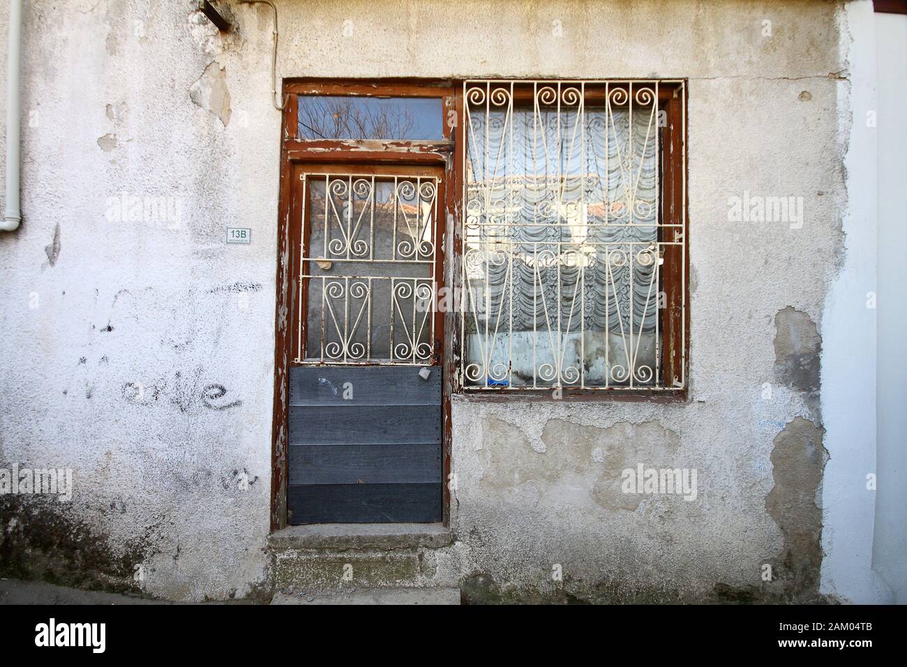 An old house built with bricks and stone A simple village architecture ...