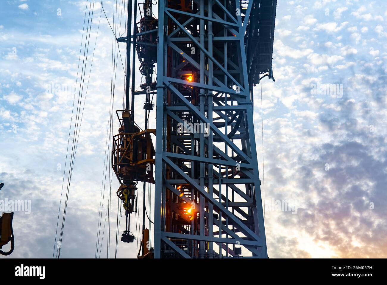 Offshore Drilling during sunset in the Gulf of Mexico Stock Photo - Alamy