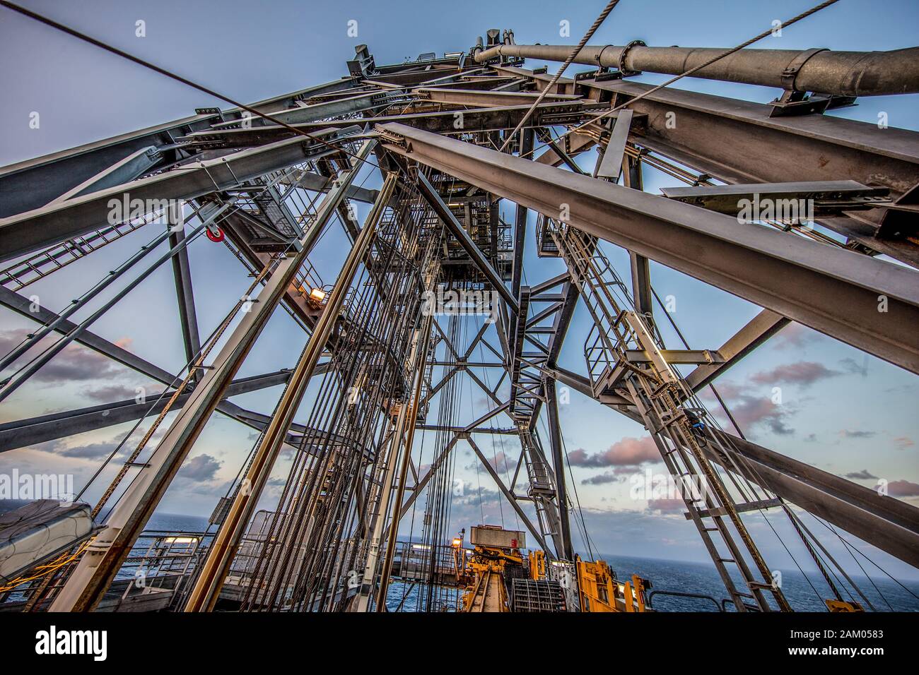 Offshore Drilling during sunset in the Gulf of Mexico Stock Photo - Alamy