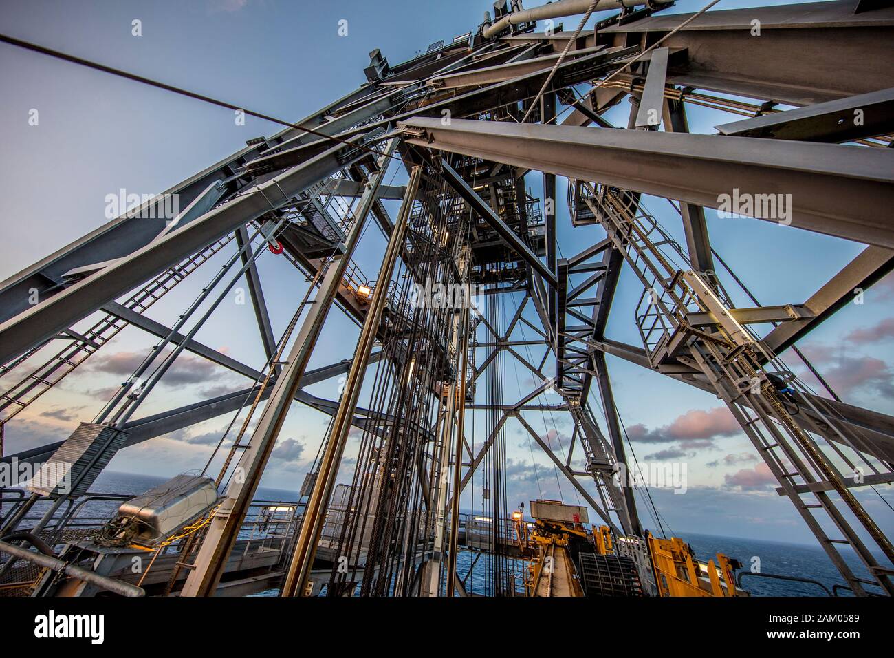 Offshore Drilling during sunset in the Gulf of Mexico Stock Photo - Alamy