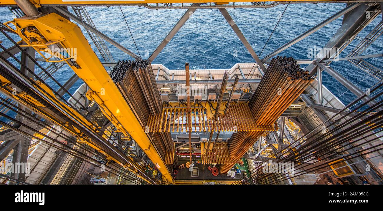Offshore Drilling during sunset in the Gulf of Mexico Stock Photo - Alamy