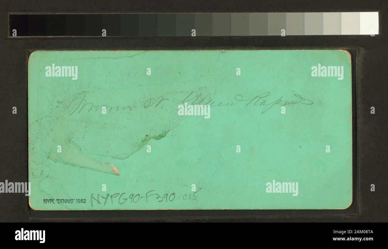 Street scene with buildings, trolley tracks, store fronts, and ...