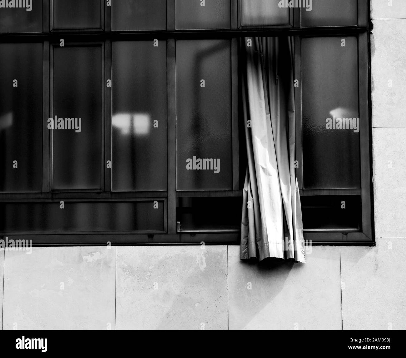 Open window with a curtain hanging out, opportunity for a burglary ...