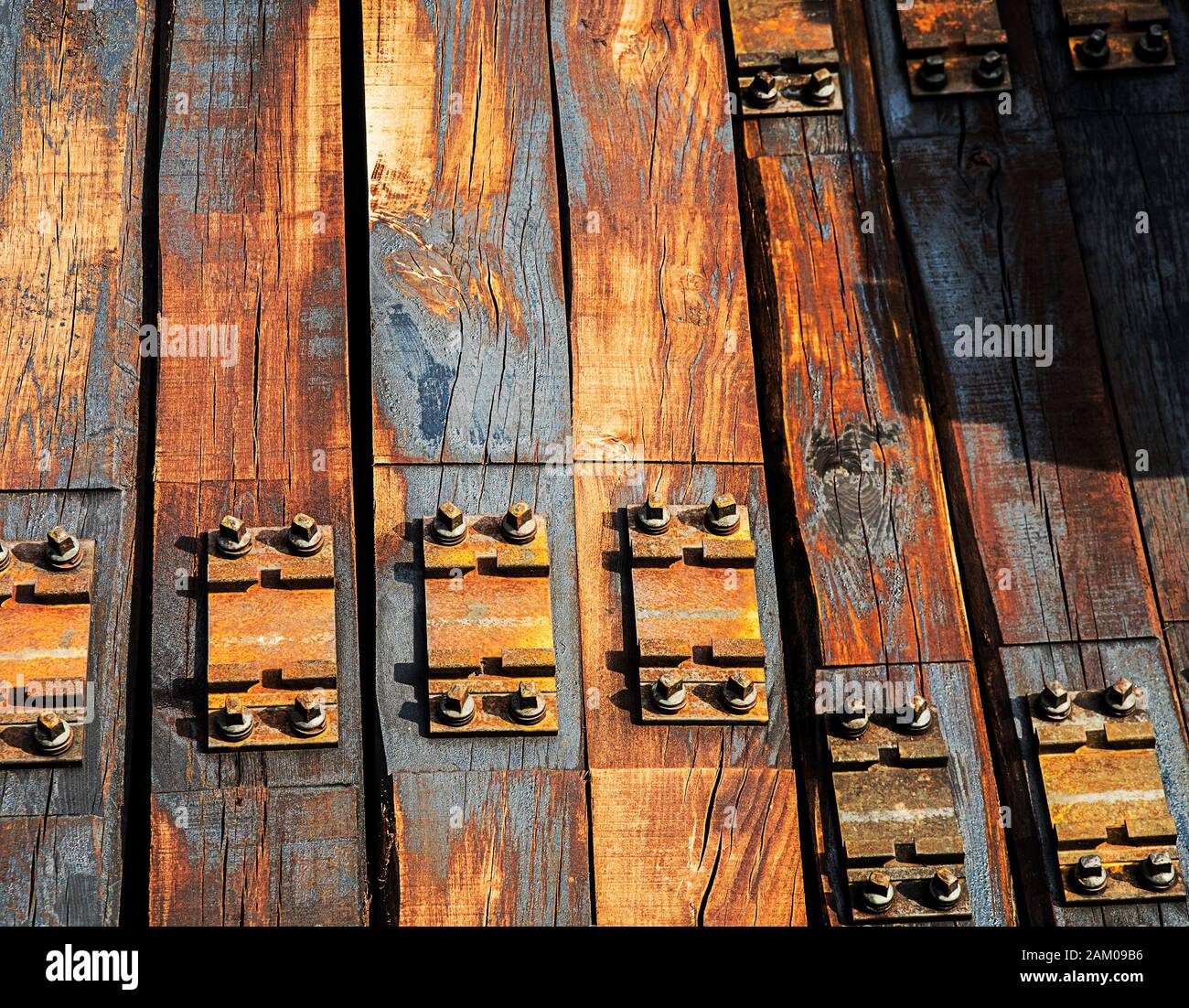 wooden logs for train railroad stacked on a pile Stock Photo - Alamy