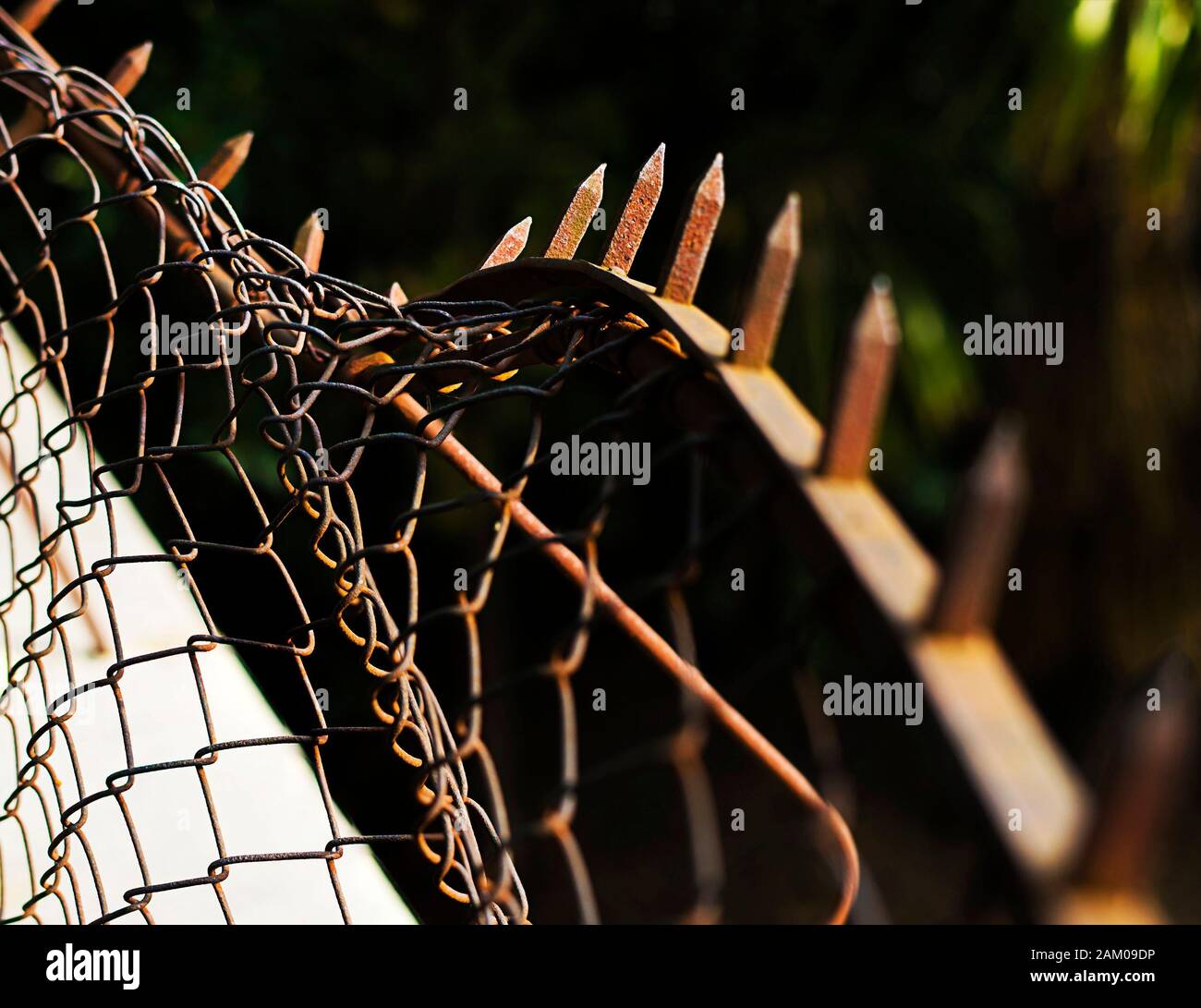 Twisted fence symbolizing use of force Stock Photo - Alamy
