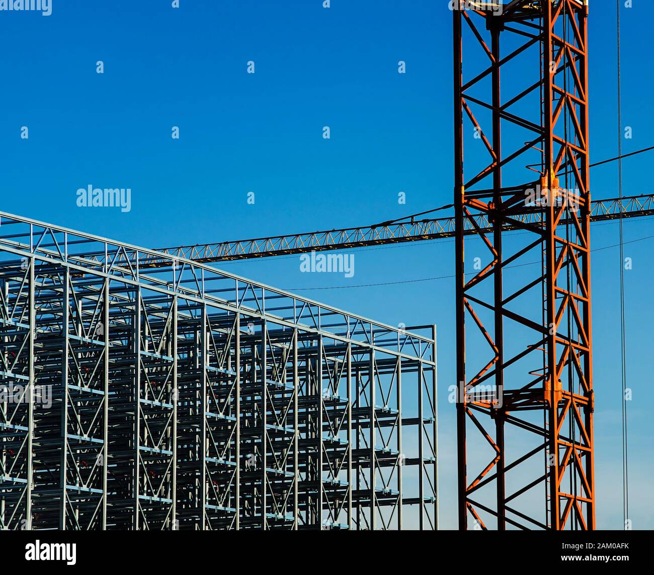 Construction cranes with a metal structure frame being built Stock ...