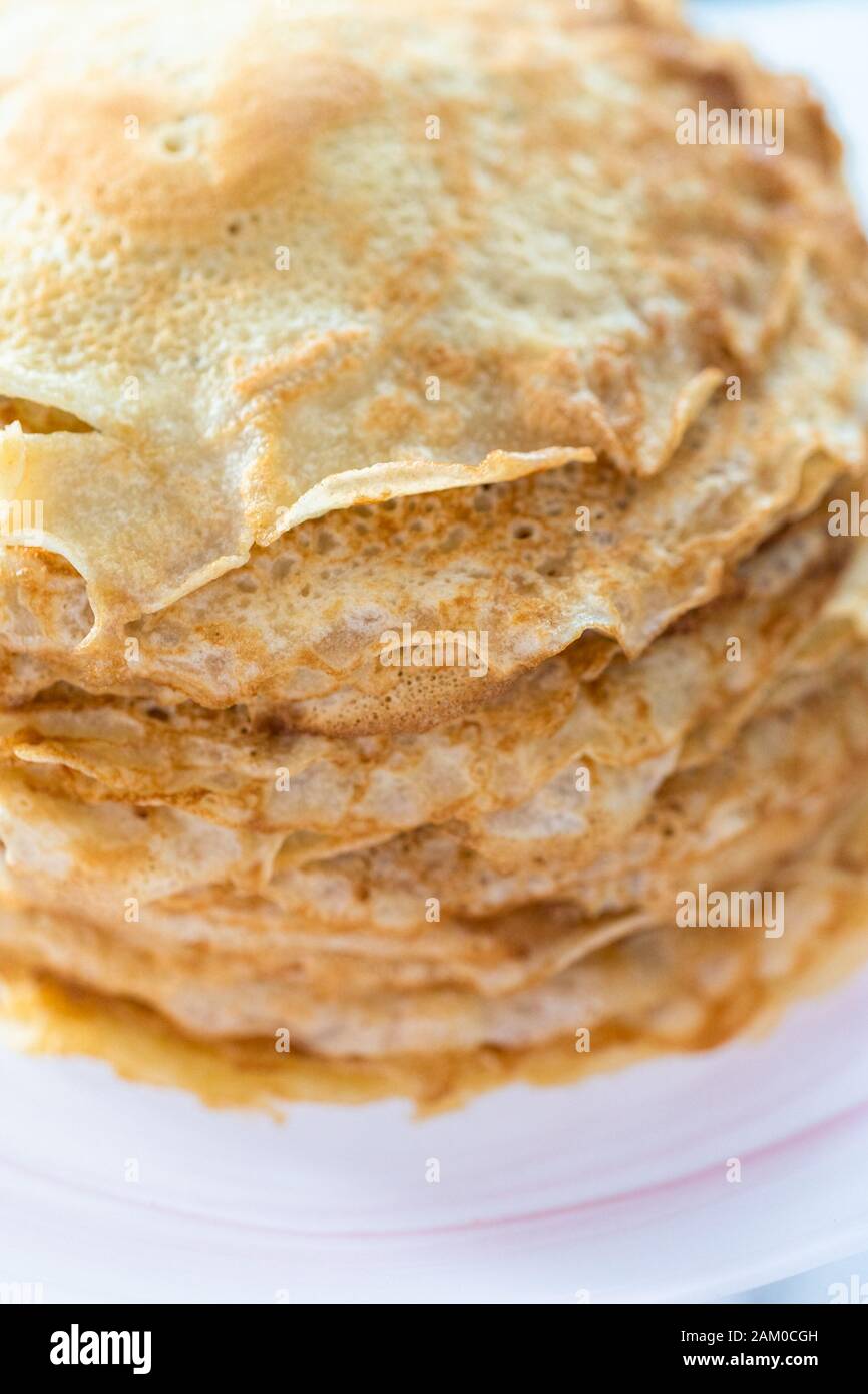 Stack of freshly baked crepes on a cake stand Stock Photo - Alamy