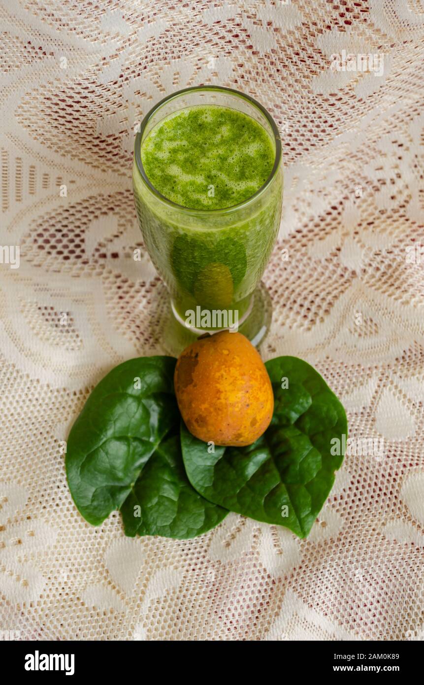 Homemade Spinach And June Plum Juice Stock Photo - Alamy