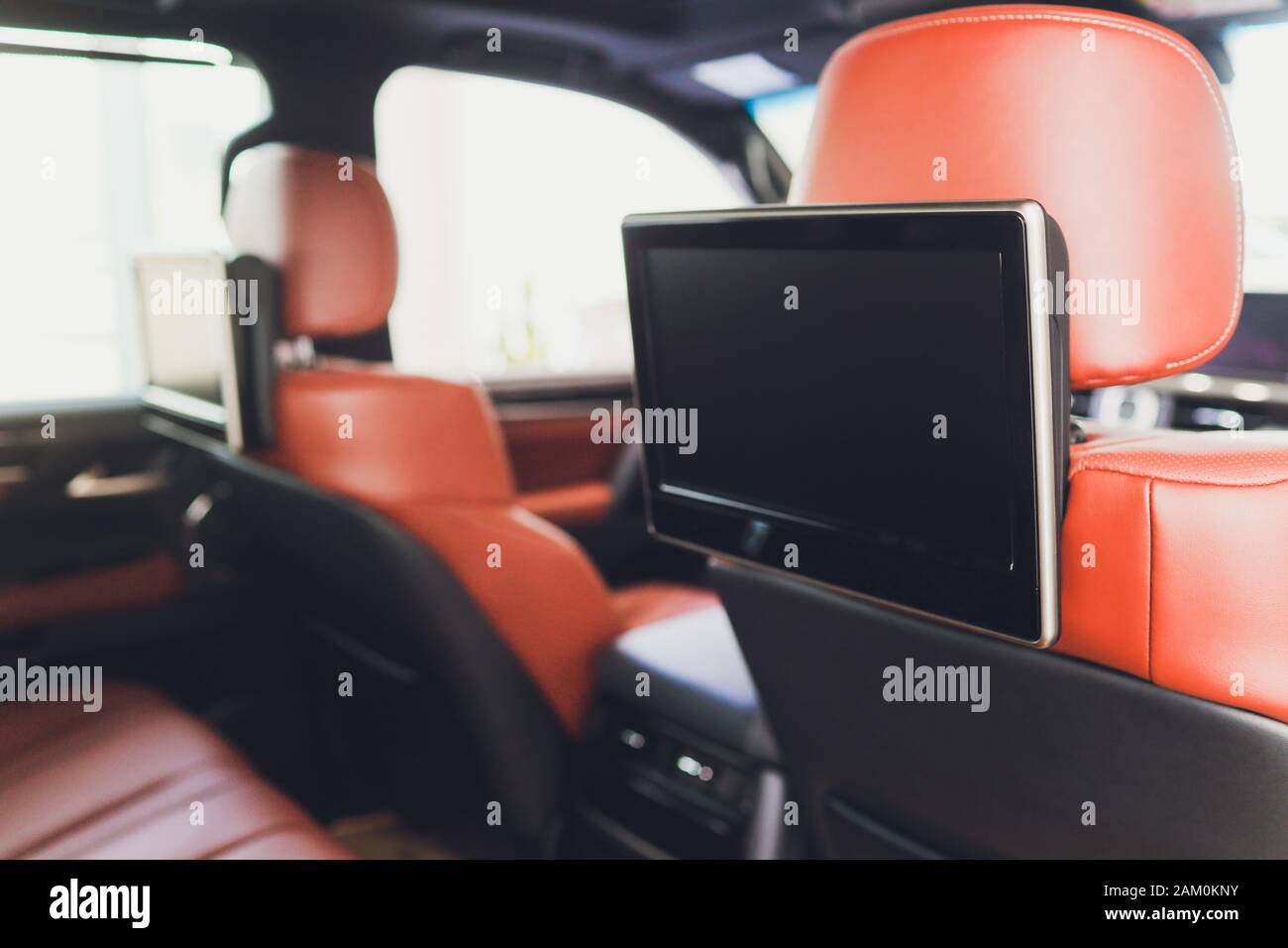 Car inside. Interior of prestige modern car. Back seats with displays ...