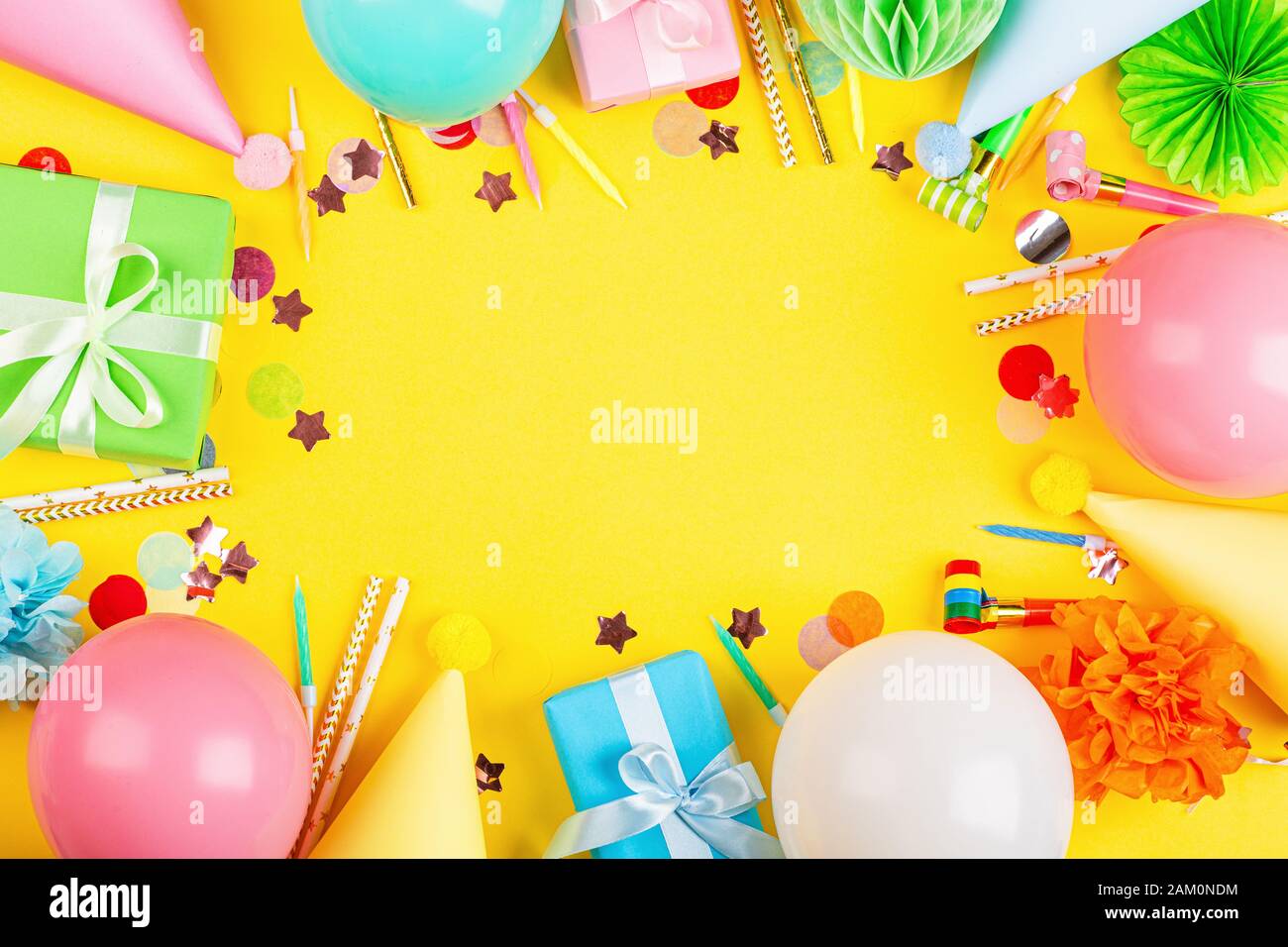 Birthday decor on yellow background, top view. Flat lay style. Mockup ...