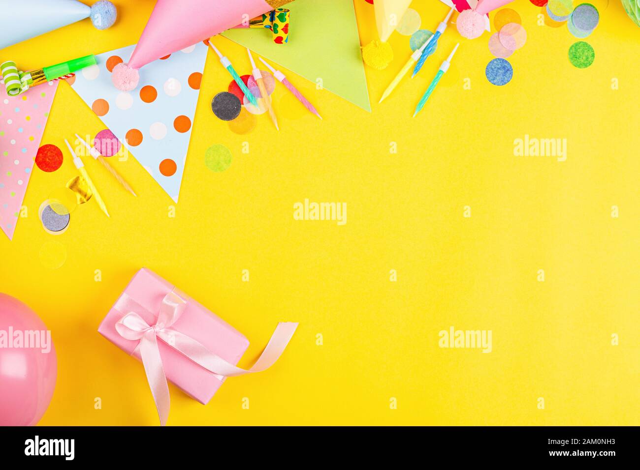 Birthday decor on yellow background, top view. Flat lay style. Mockup ...