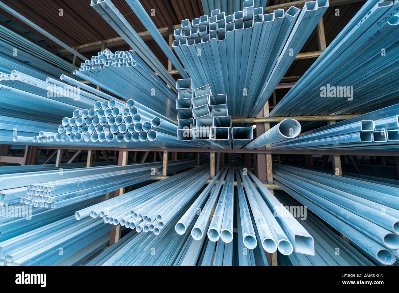 Steel Pipes Industry Construction stacked in Factory warehouse Stock ...