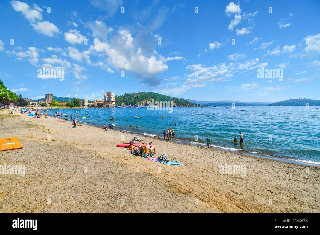 Tourists enjoy a sunny day at the beach of Independence Point at Lake ...