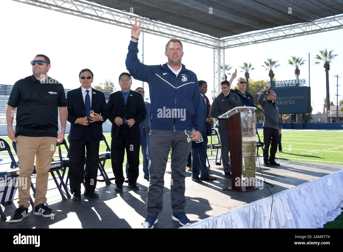 St. John Bosco Braves coach Jason Negro (second from left) stands ...