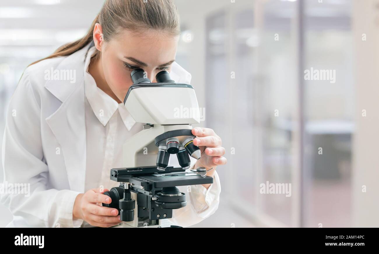 Scientist researcher using microscope in laboratory. Medical healthcare ...