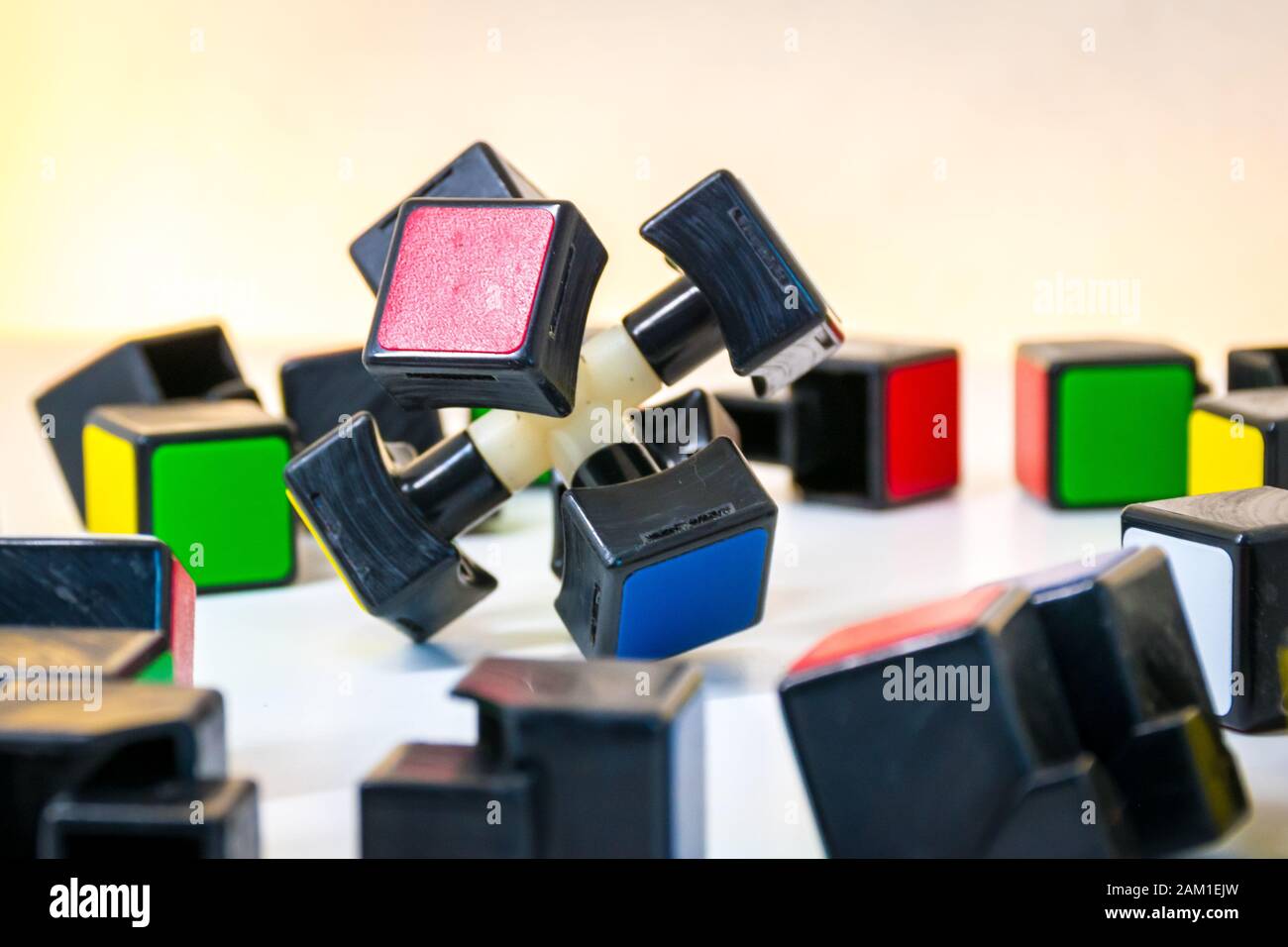 Magic cube in pieces for problem solving on yellow background Stock ...