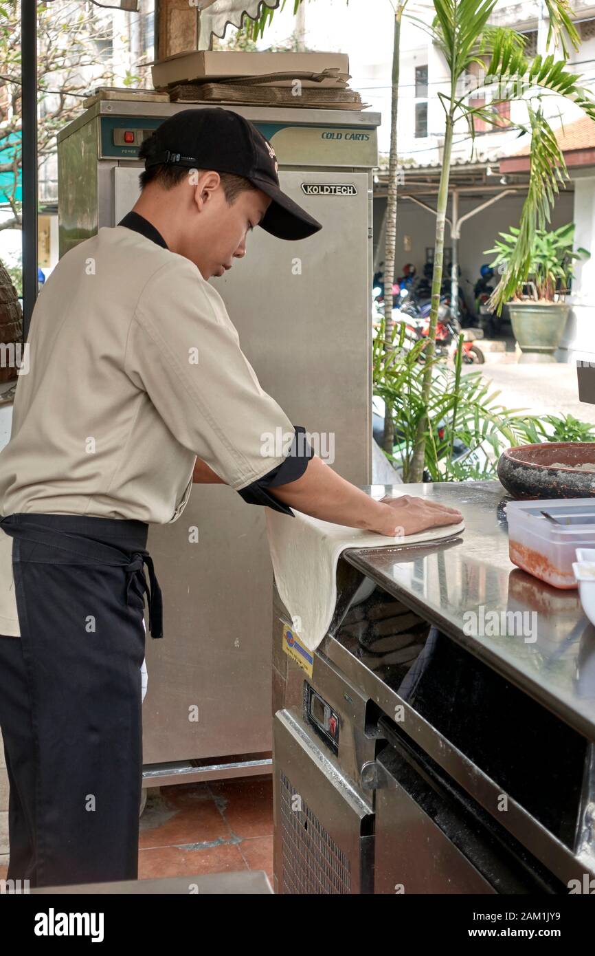 Pizza chef preparing pizza in a restaurant kitchen Stock Photo - Alamy