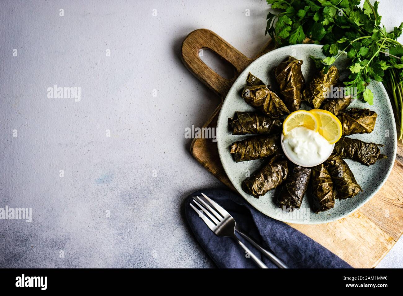 Traditional georgian tolma in vine leaves on rustic background with ...