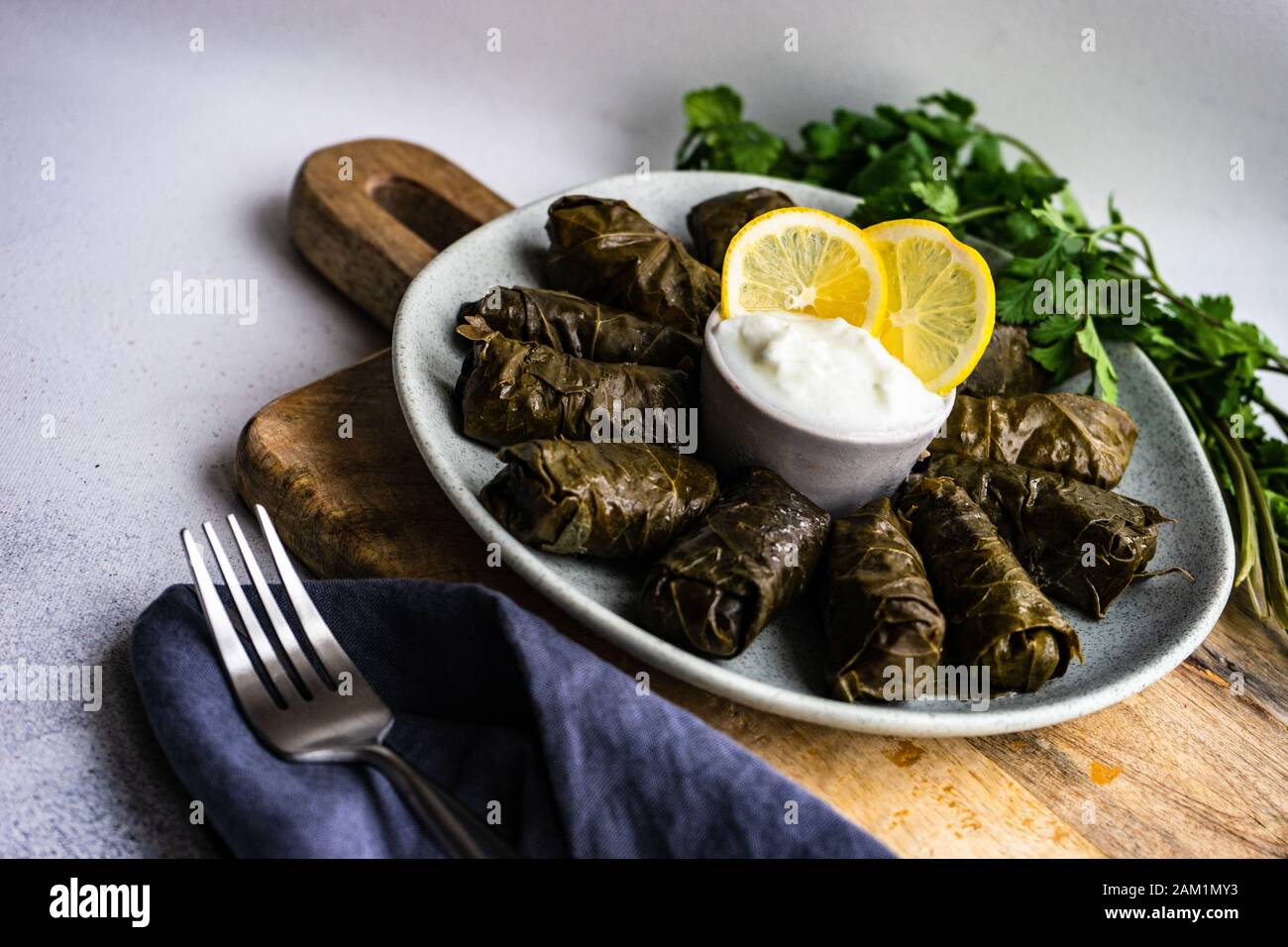 Traditional georgian tolma in vine leaves on rustic background with ...