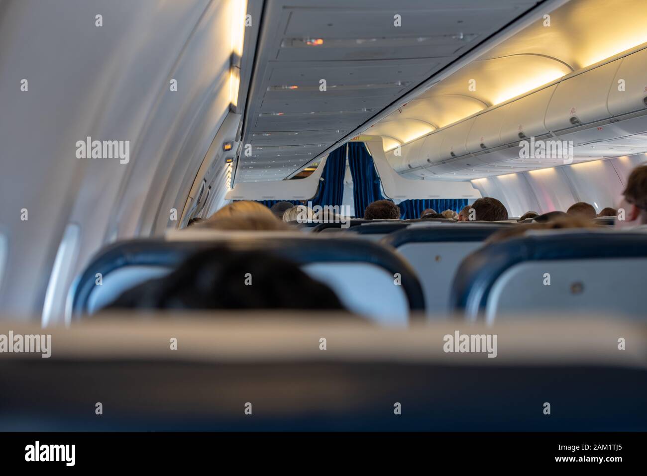Passengers inside airplane hi-res stock photography and images - Alamy