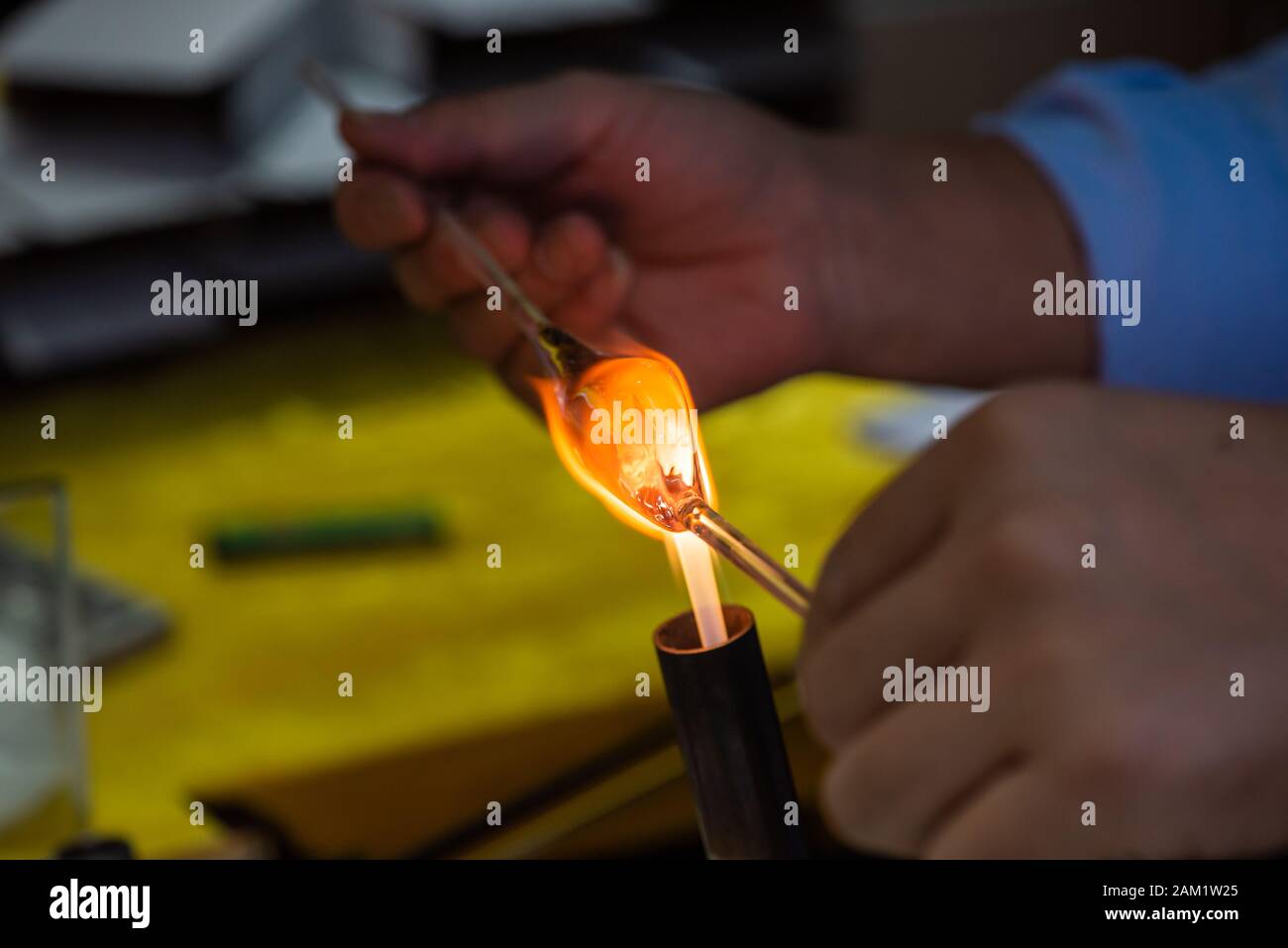 Artist works on glass with fire close-up view in Guiling, Guangxi ...