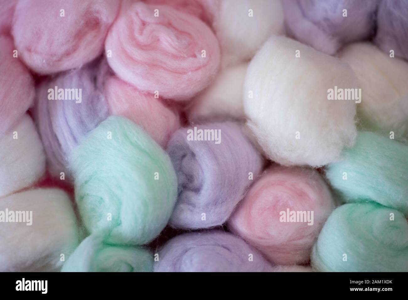 Close up shot of pastel colored cotton puffs Stock Photo - Alamy