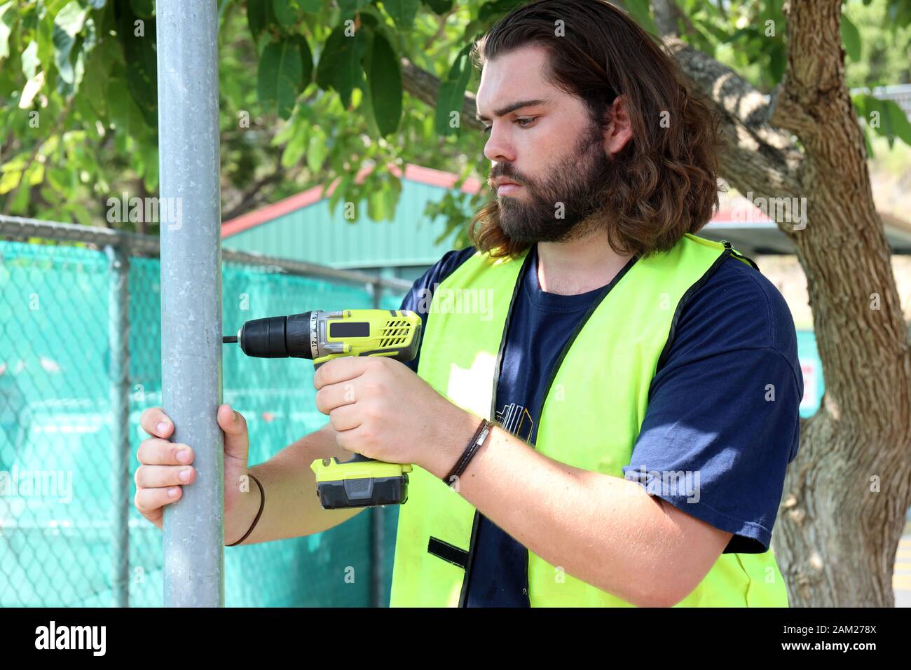Construction worker doing his job on a site, fixing and repairing ...