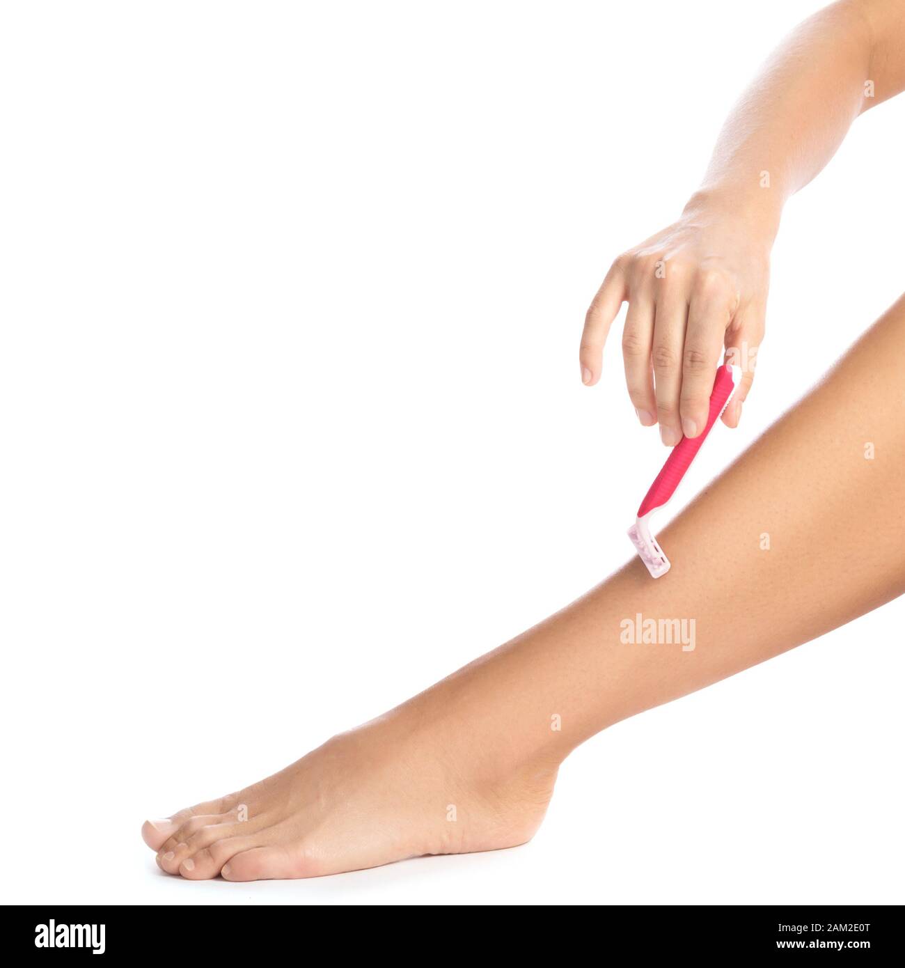 Female legs and shaving razor on white background Stock Photo - Alamy