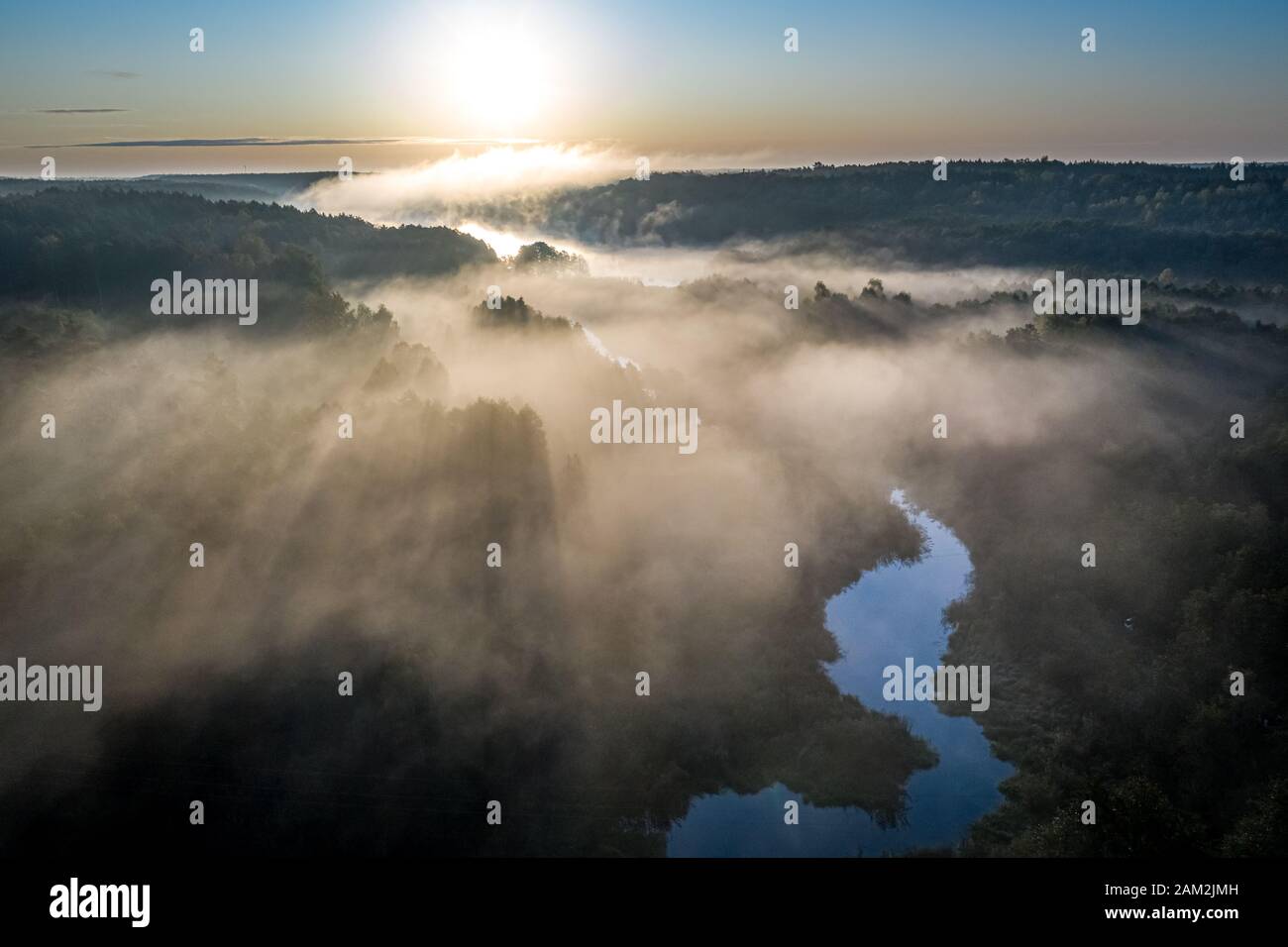 Stunning view top mist over river at sunrise, aerial view Stock Photo ...