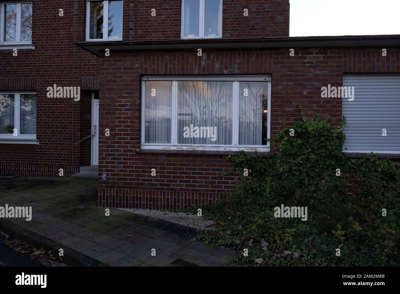 Lights seen through window of house in coal mining town, Immerath ...